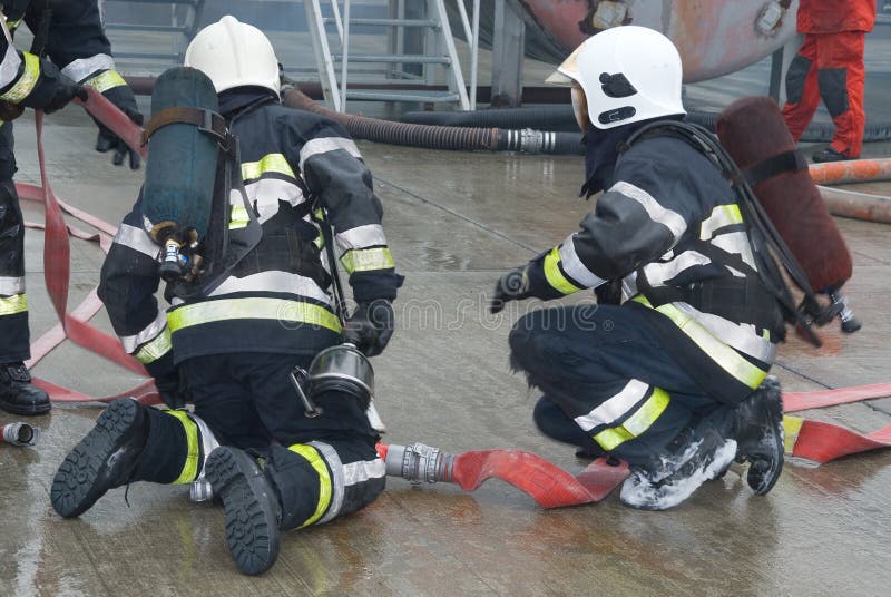 Fire Fighters Preparing Hoses Stock Image - Image of extinguish ...
