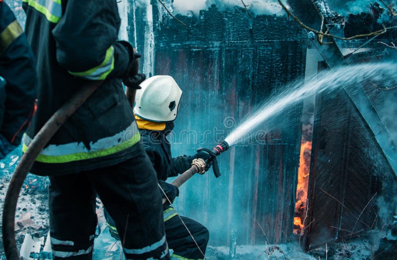 Fire Fighters Putting Out a House Fire. Stock Photo - Image of putting ...