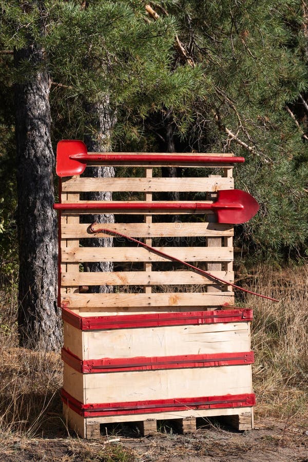 Fire Fighting Equipment with Sand Box in Forest is Painted Red. Stock ...