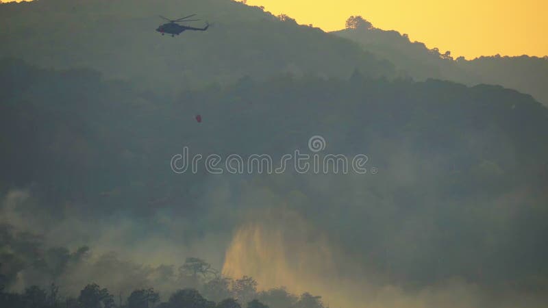 Fire Fighting Helicopter Dropping Water on Wildfire Stock Footage ...