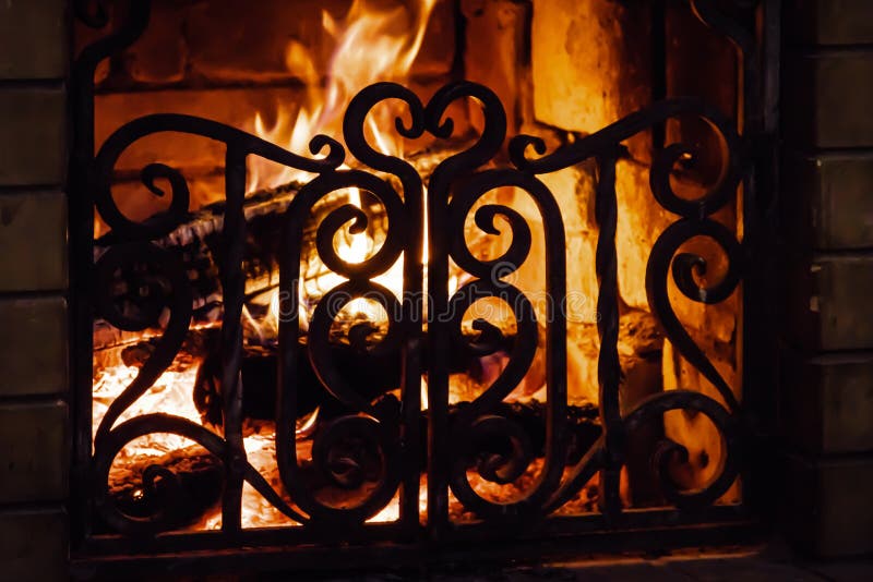 Fire in the Fireplace Behind the Grate Stock Image - Image of closed ...