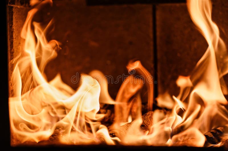 Fire in the fireplace stock image. Image of impressive - 227047415