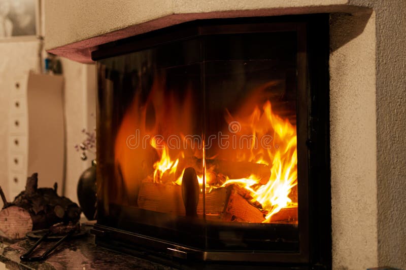 Fire in a Fireplace in the Living Room with Accessories Stock Image ...