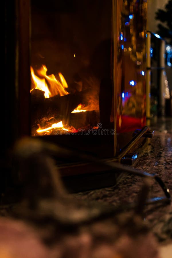 Fire in a Fireplace in the Living Room with Accessories Stock Photo ...