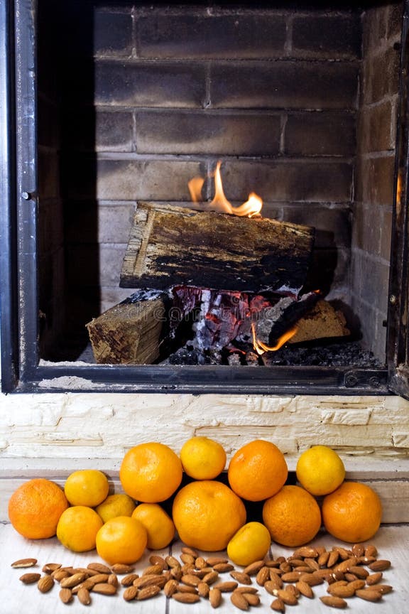 Fire in the Fireplace and Tangerines and Nuts Stock Photo - Image of ...