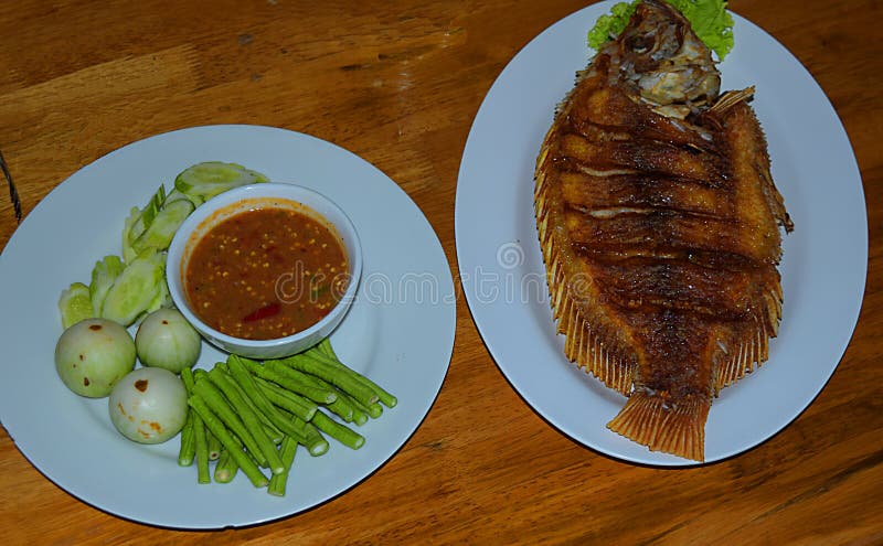 Fire fish stock image. Image of food, sauce, fried, tilapia - 79665573