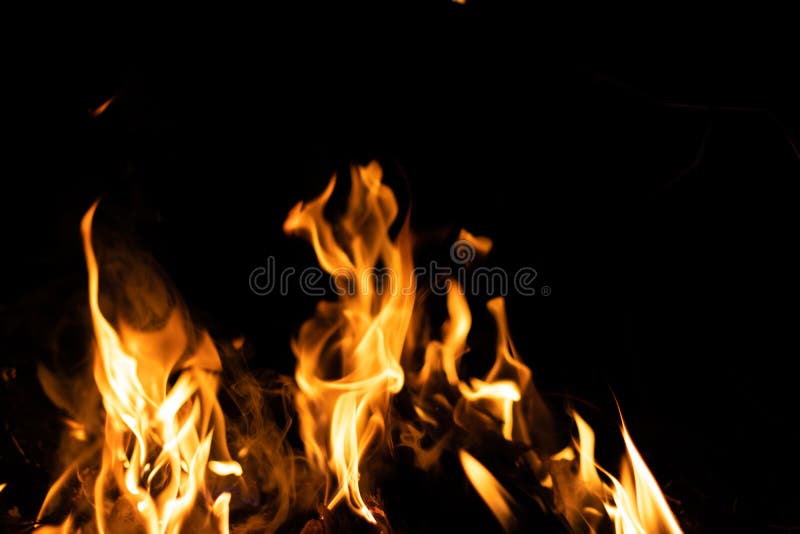 Fire Flames on a Black Background. Abstract Fiery Texture. Realistic ...