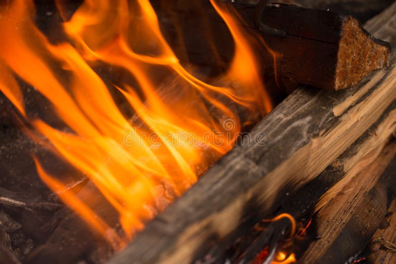 Fire and Flames Firing Up from Wood. Burning Wood Closeup Stock Photo ...
