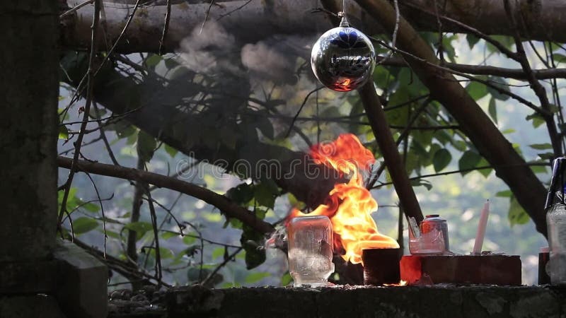Fire Flames between Two Broken Cans and a Large Ball on Top of Which ...