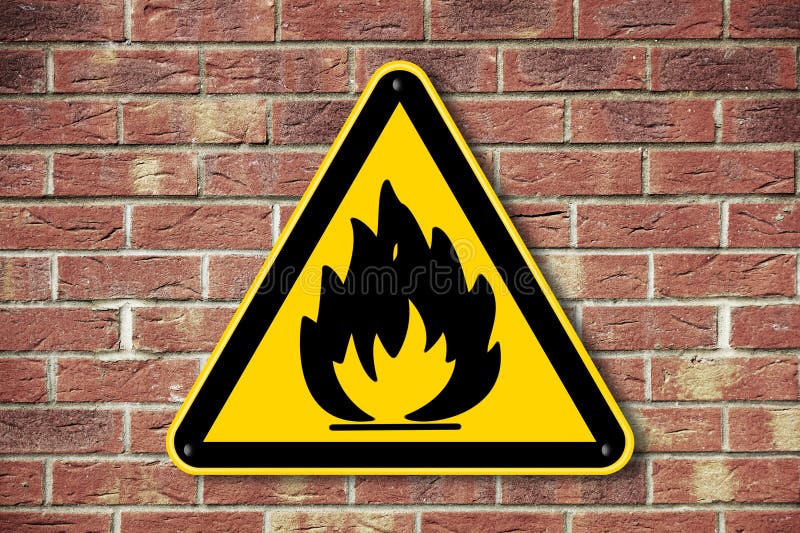 Fire Hazard Warning Sign on a Brick Wall Background Stock Image - Image ...