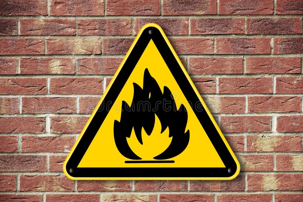 Fire Hazard Warning Sign on a Brick Wall Background Stock Image - Image ...