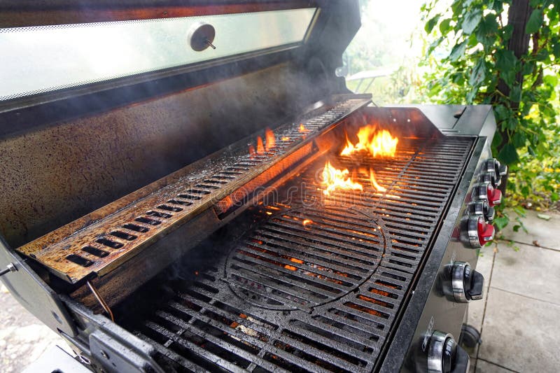 The Fire Heats Up the Grate on a Gas Grill for Grilling Meat Stock ...