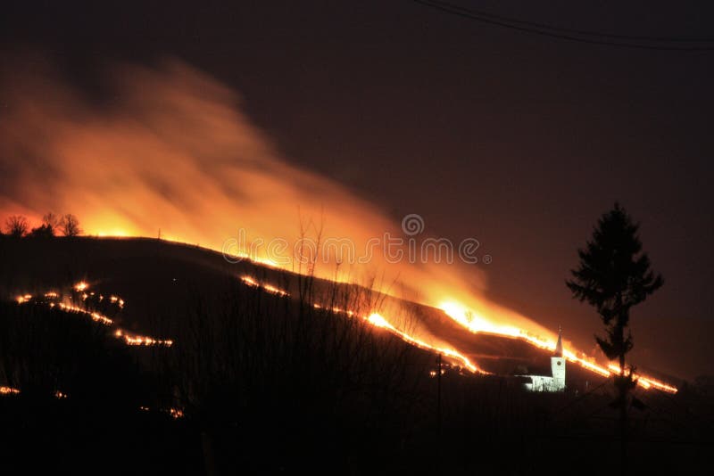 Fire on the hill at night stock photo. Image of emergency - 186560558