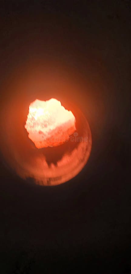 Fire in hole stock image. Image of light, hole, orange - 263776815
