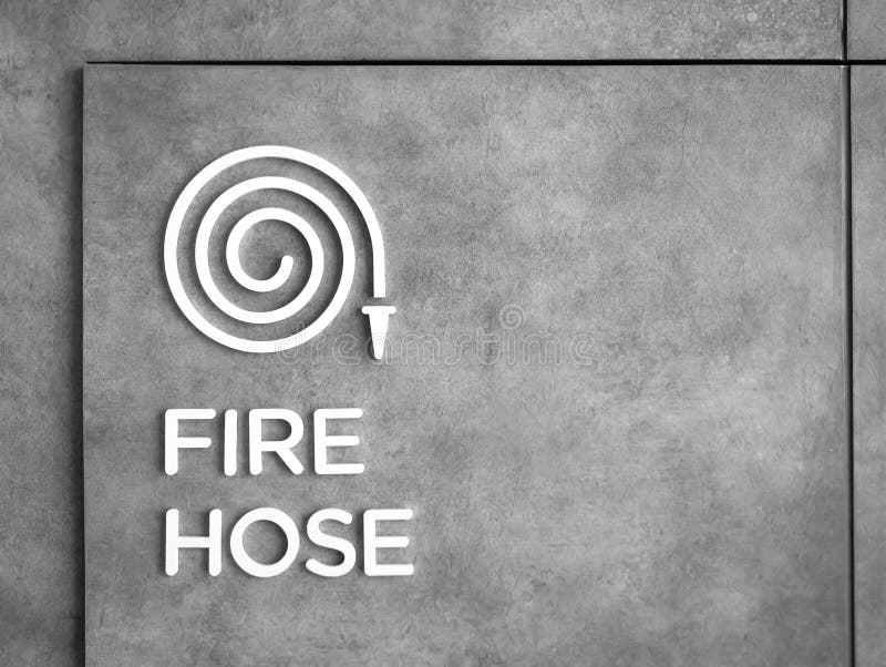 Fire hose sign stock photo. Image of reel, hazard, background - 66522482