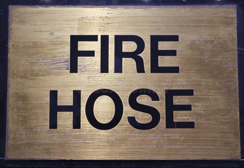 Fire Hose Sign on Gold Brass Background Stock Image - Image of hoses ...