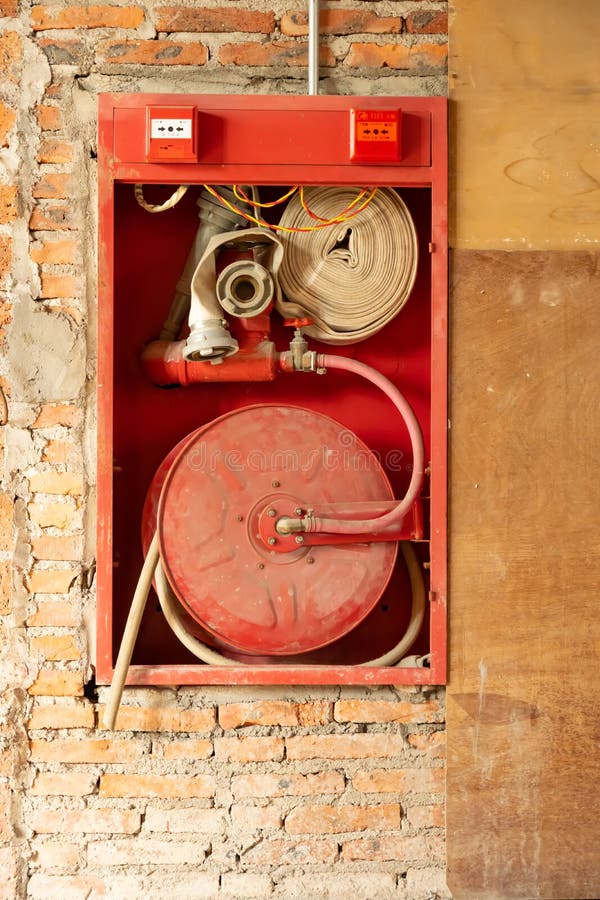 A Fire Hose on the Wall Vertical Composition Stock Photo - Image of ...