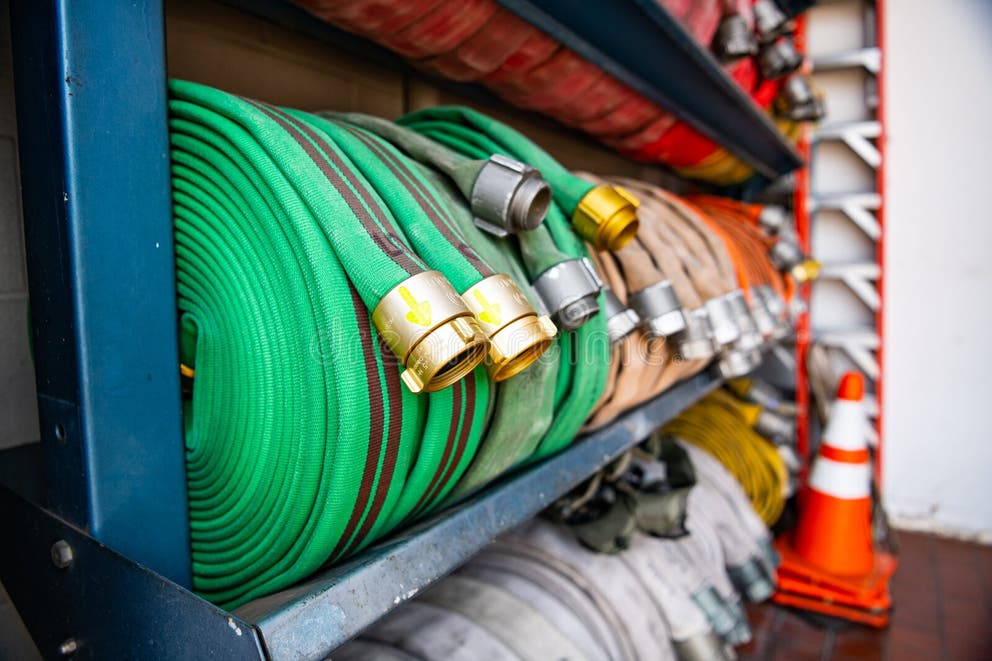 Fire Hoses of Different Colors are Stacked in Rows on a Fire Rack Stock ...