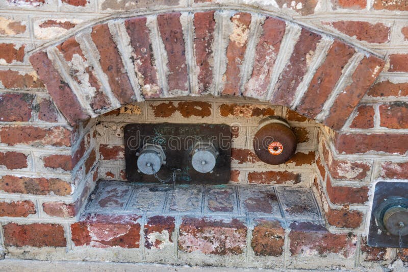 Fire Hydrant in Brick Wall of Building Stock Photo - Image of chrome ...