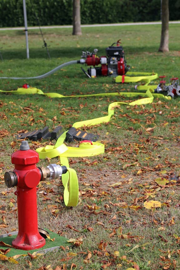 Fire Hydrant with Brightly Colored Hose during a Drill Stock Photo ...