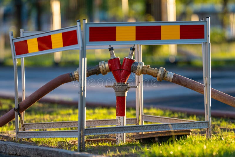 Fire Hydrant Connection with Hoses and Barriers.. Stock Image - Image ...