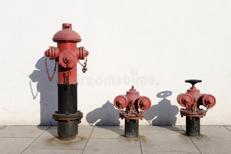 Fire Hydrant Connection Points in Front of White Wall Stock Photo ...