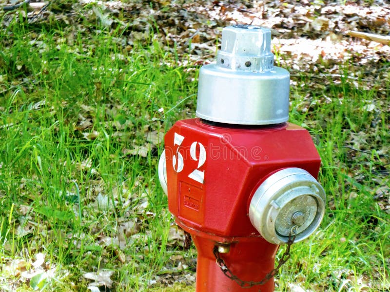Fire Hydrant on Grass Field. Red Metal Firefighter Infrastructure Stock ...