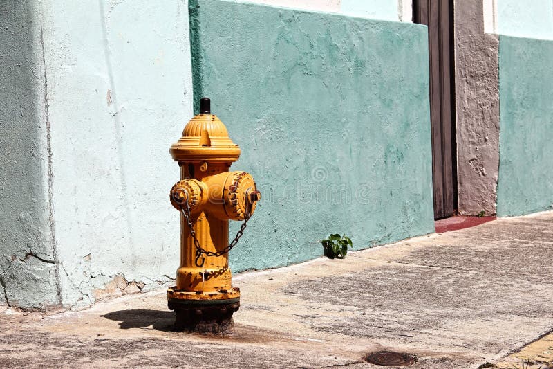 A Fire Hydrant Sits in Front of an Old Building Stock Photo - Image of ...