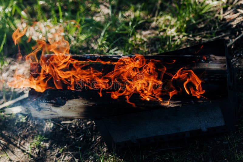Fire Lit in the of a Campsite Stock Photo - Image of grill, effect ...