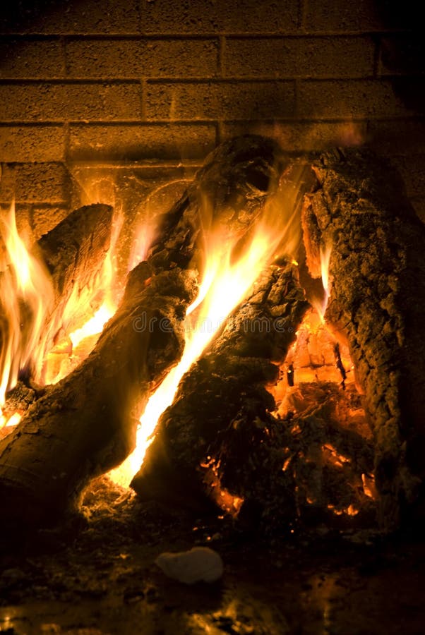 Fire lit in the fireplace stock image. Image of interior - 109550397