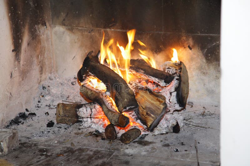 Fire Lit in a Fireplace of a House Stock Image - Image of garden ...