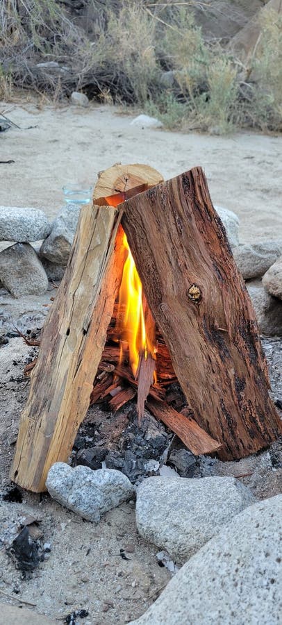 Fire Lit by Rocks and Wood on the Beach Stock Image - Image of seashore ...