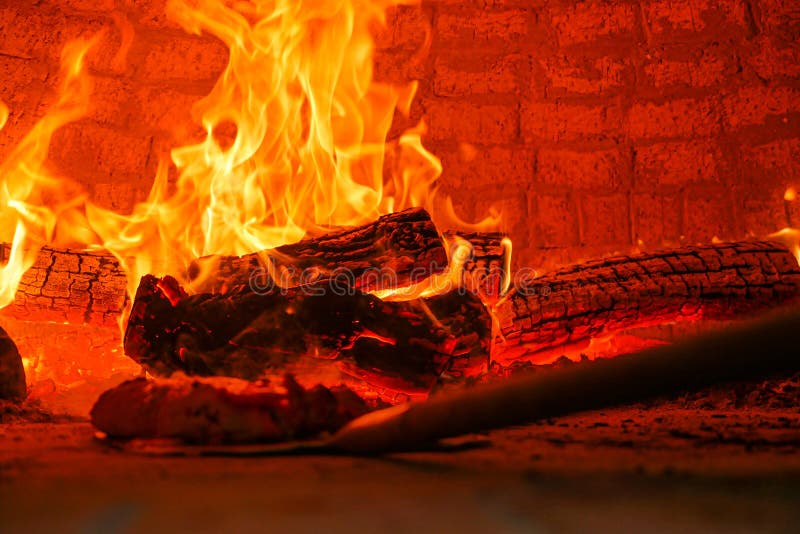 Fire Logs in Flames Inside Hearth Stock Photo - Image of stone ...