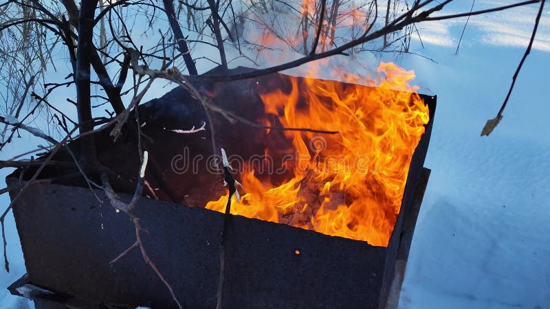 Fire in a Metal Barrel. Burning Garbage in an Iron Container in Winter ...