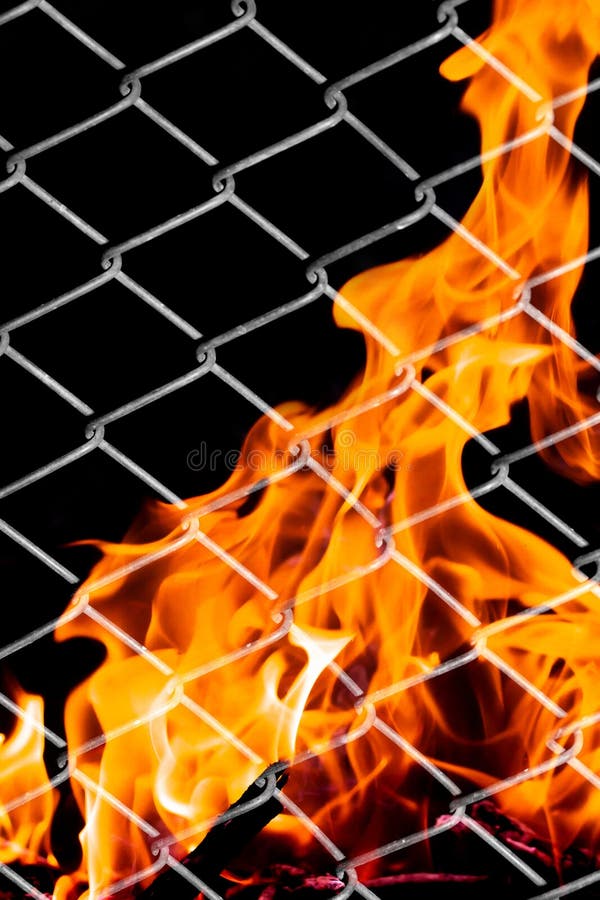 Fire in a metal grid stock image. Image of fence, glowing - 104655295
