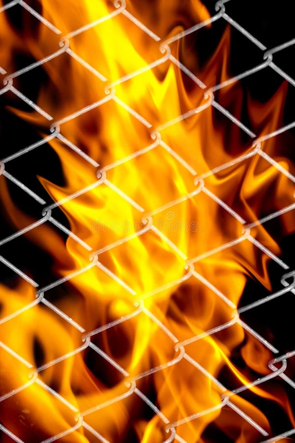 Fire in a metal grid stock photo. Image of industrial - 105263844