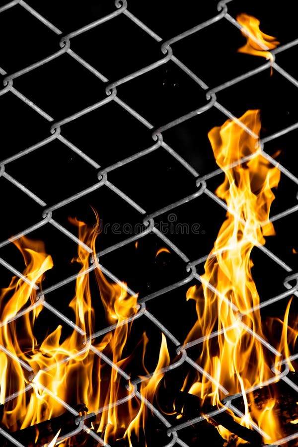 Fire in a metal grid stock image. Image of call, light - 105263867