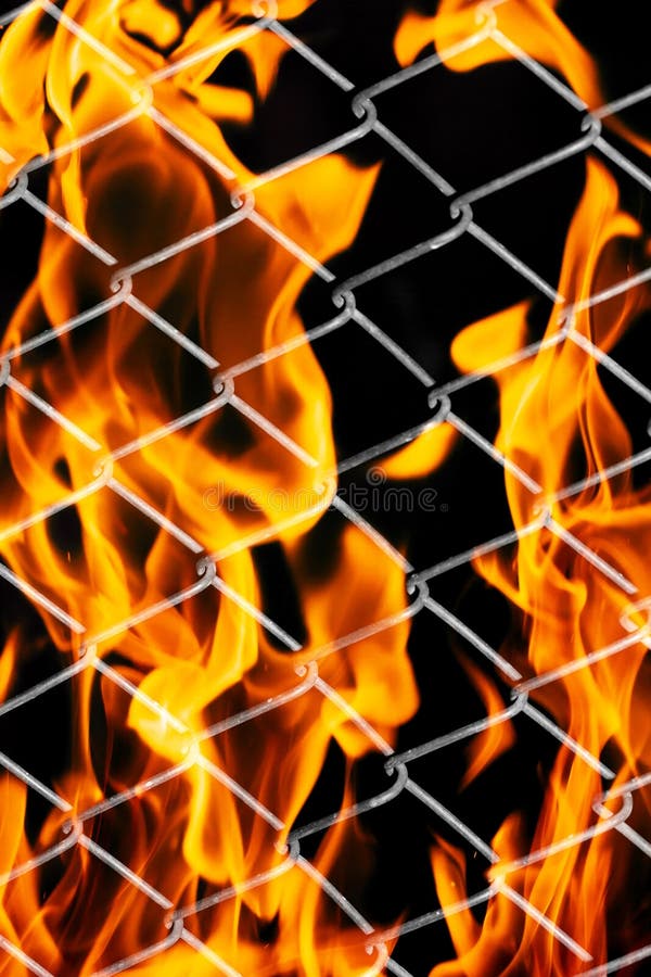 Fire in a metal grid stock image. Image of background - 105264361