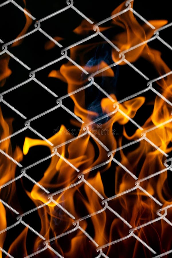 Fire in a metal grid stock photo. Image of industrial - 105264470