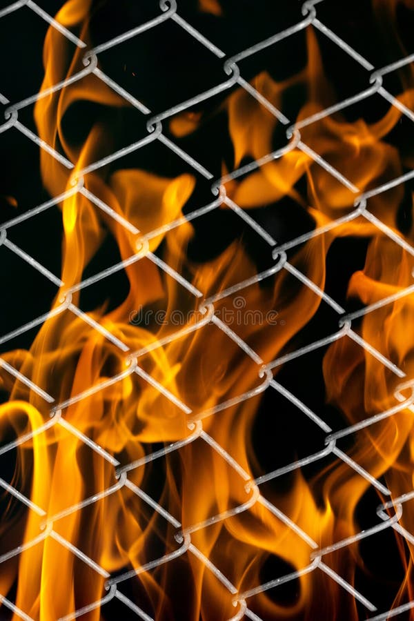 Fire in a metal grid stock photo. Image of flamed, enclose - 105264708