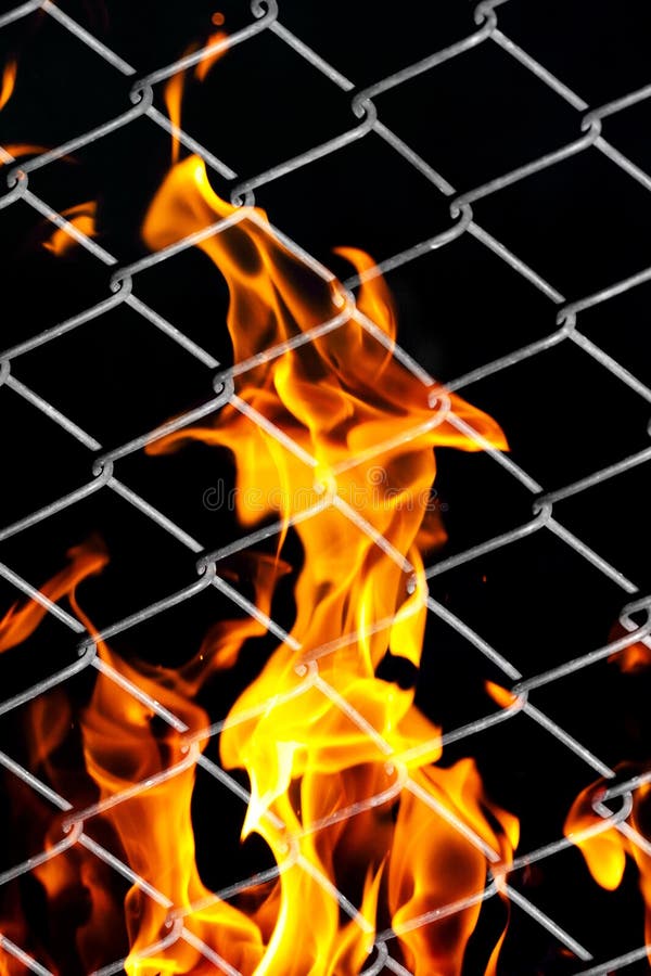 Fire in a metal grid stock image. Image of danger, activate - 105264641