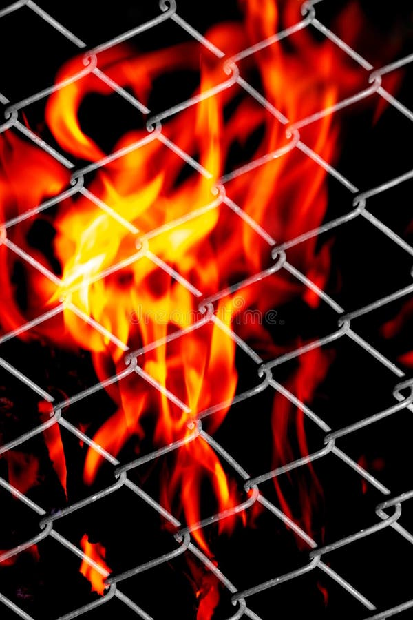 Fire in a metal grid stock photo. Image of activate - 105263600