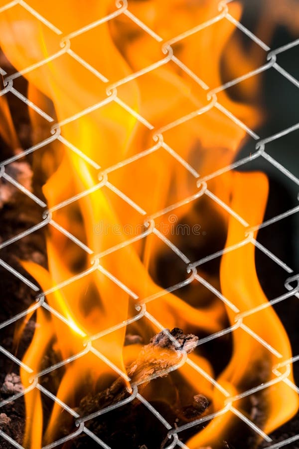 Fire in a metal grid stock photo. Image of flamed, alert - 105263772