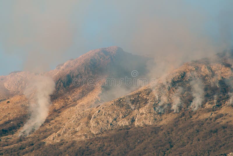 Fire in the Mountains in the Afternoon. Smoke Over the Mountains Stock ...