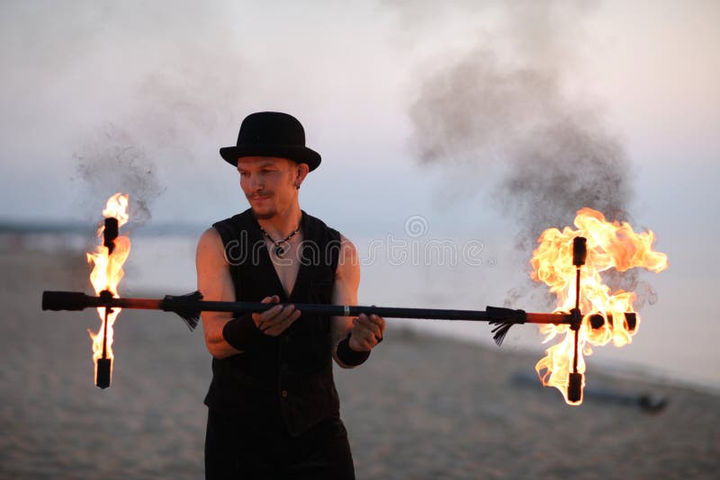 Fire Performer with a Fire Baton Stock Image - Image of dance, fumes ...