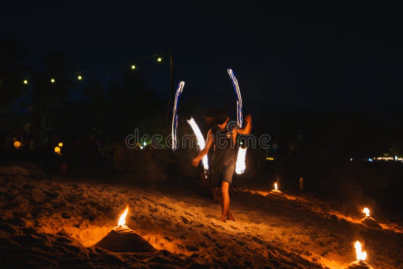 Fire Performer Spinning Flames on a Tropical Beach at Night Stock Photo ...
