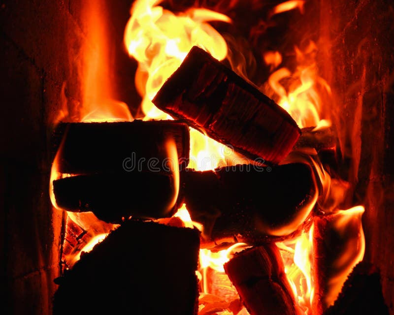 Fire. Photo of Flames Devouring Firewood in a Stone Fireplace. the ...