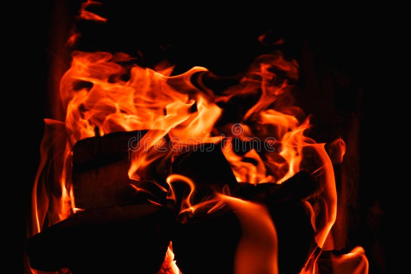Fire. Photo of Flames Devouring Firewood in a Stone Fireplace. the ...