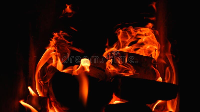 Fire. Photo of Flames Devouring Firewood in a Stone Fireplace. the ...