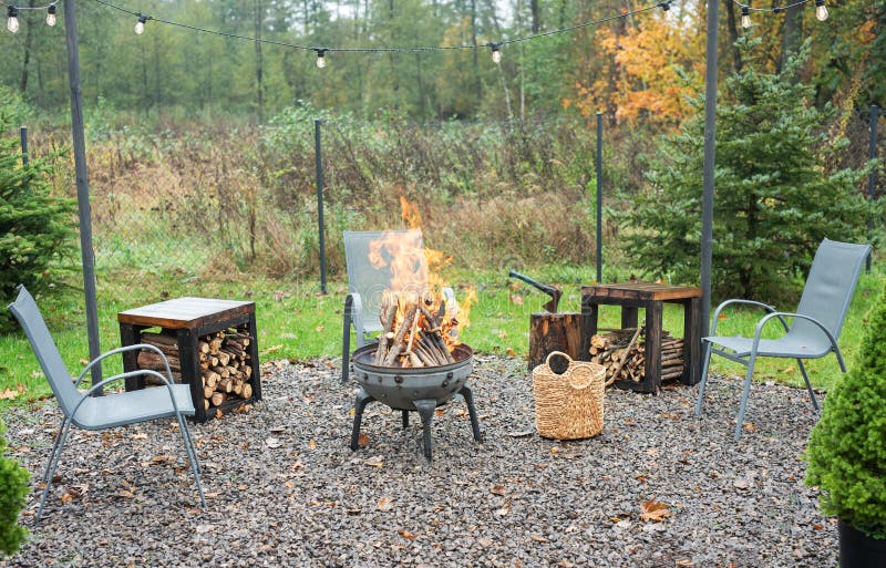 Fire Pit and Burning Fire in a Garden Stock Photo - Image of brazier ...